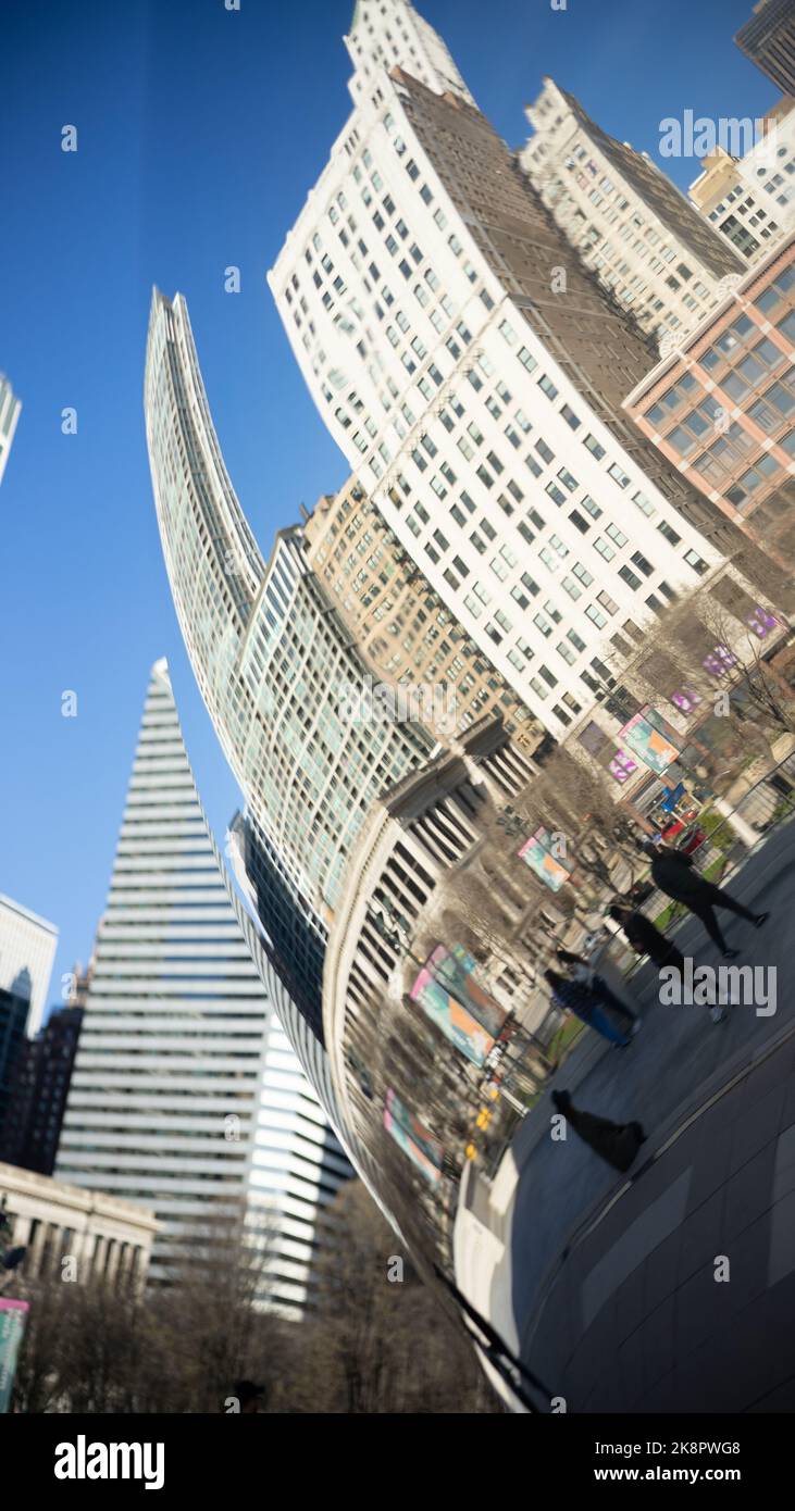 A city building reflection on the Chicago Bean in millennium square under clear sky Stock Photo ...