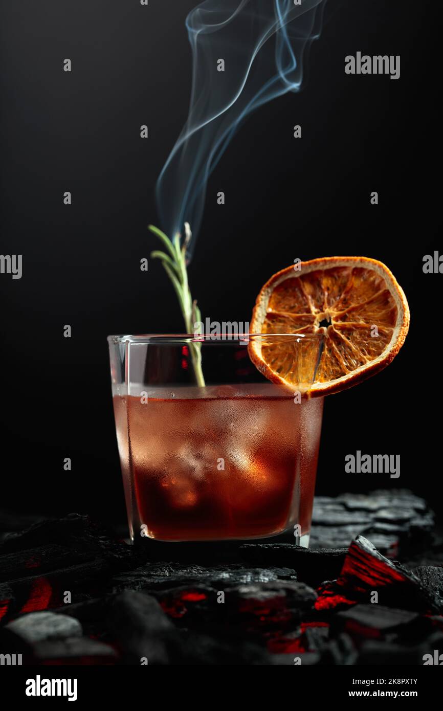 Old Fashioned Cocktail With Ice Dried Orange Slice And Rosemary