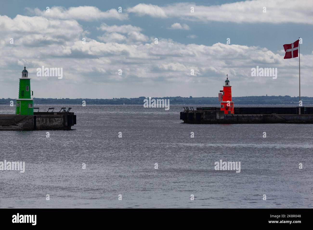 The red and a green lighthouses at the entrance of the harbor of ...