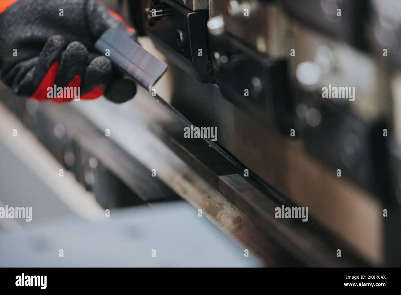 A factory worker making metal details, close-up Stock Photo - Alamy