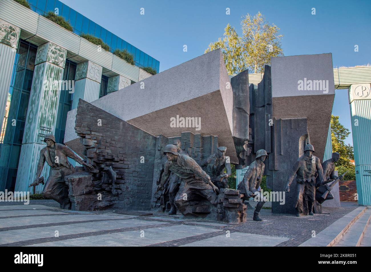 Soldiers statues and the modern Uprising Monument in Warsaw, Poland ...