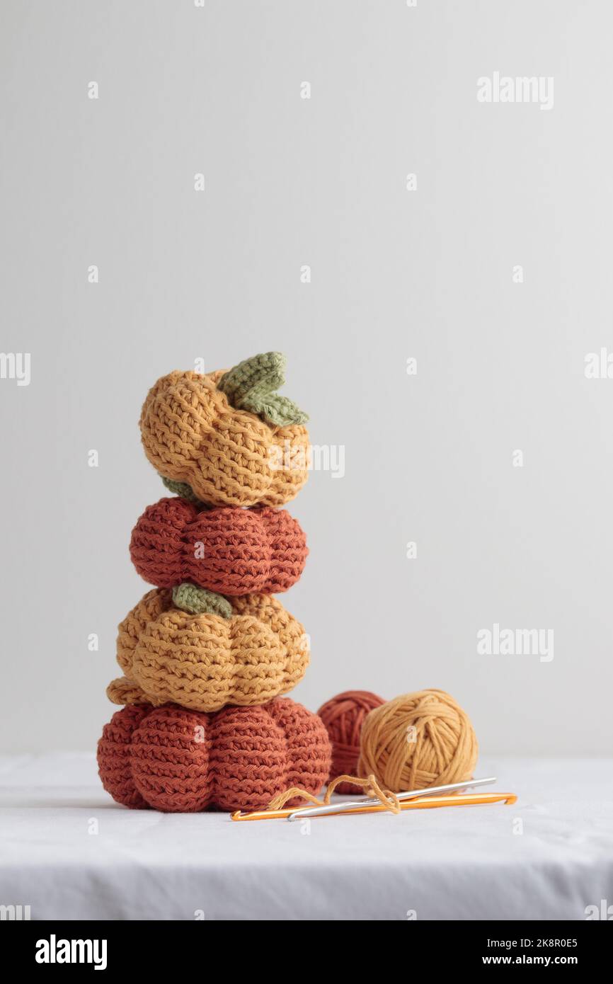 Cute crochet knitted yellow and orange pumpkins on white background ...