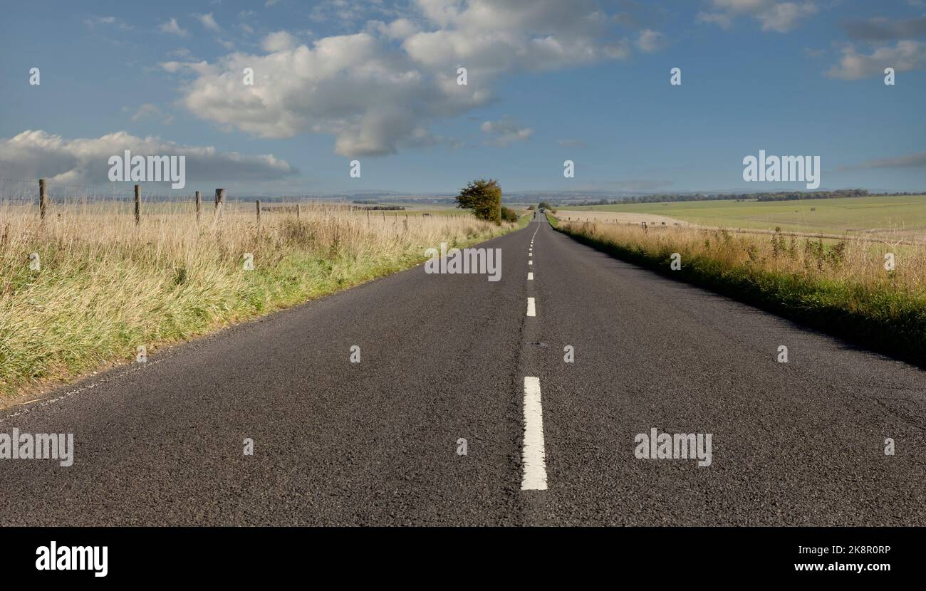 road leading to the distant blue sky and white clouds Stock Photo - Alamy