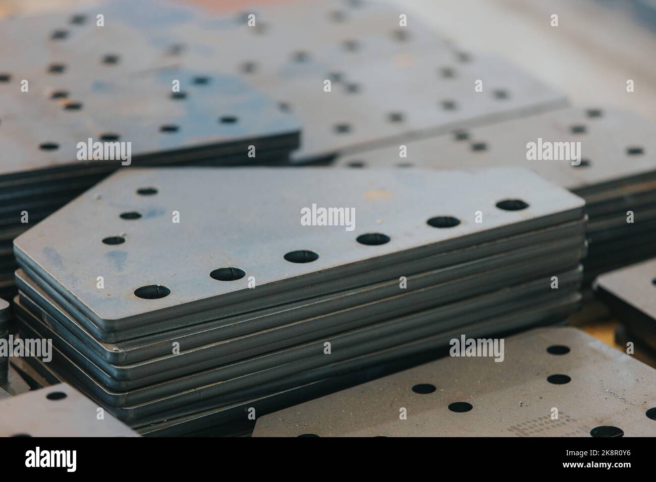A bunch of different kinds of connecting plates stacked in neat piles ...