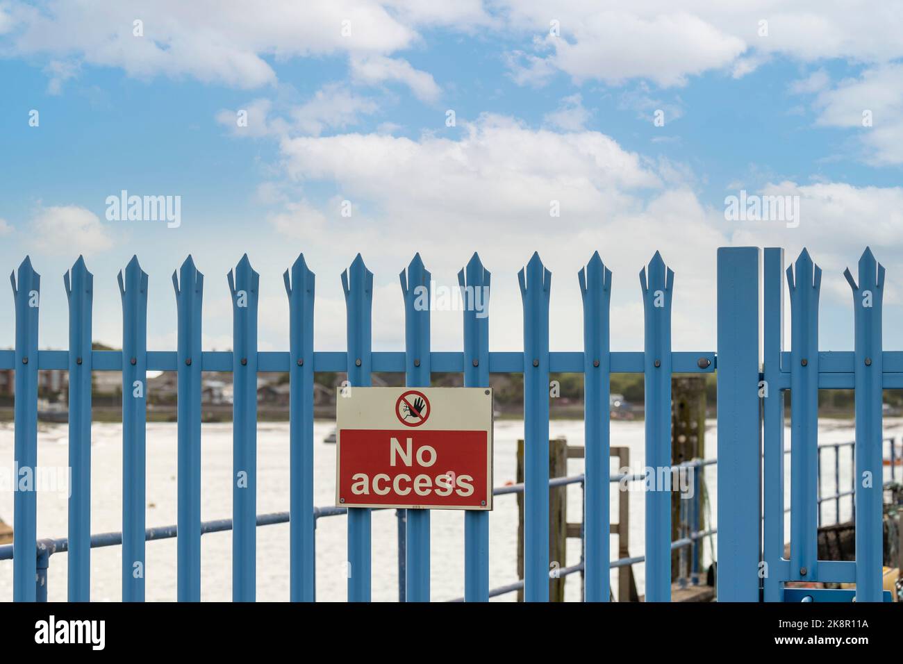 red no access sign on a blue metal fence Stock Photo - Alamy