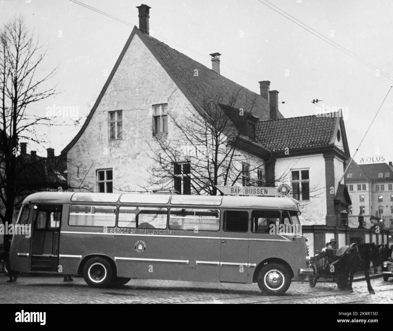 Bergen 1953. Norway's first bank bus. Men with horse and carriage next ...