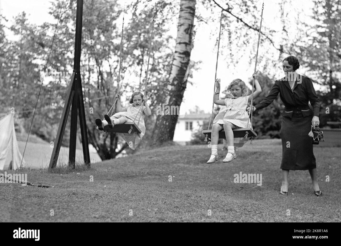 Skaugum June 1937. Princess Ragnhild (TV) and Princess Astrid play in ...