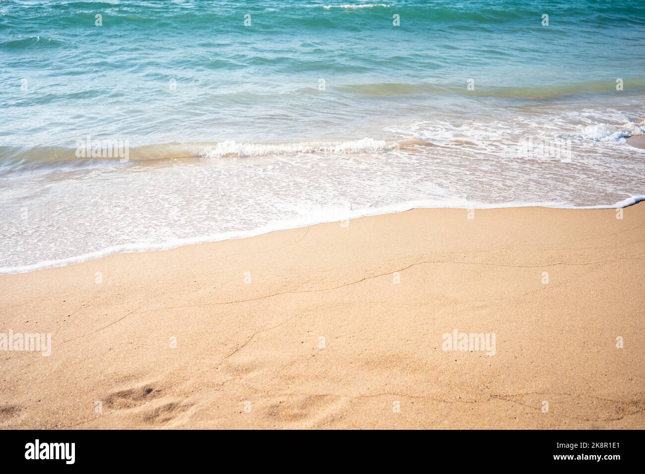 Soft beautiful ocean wave on sandy beach. Background. Turquoise color ...