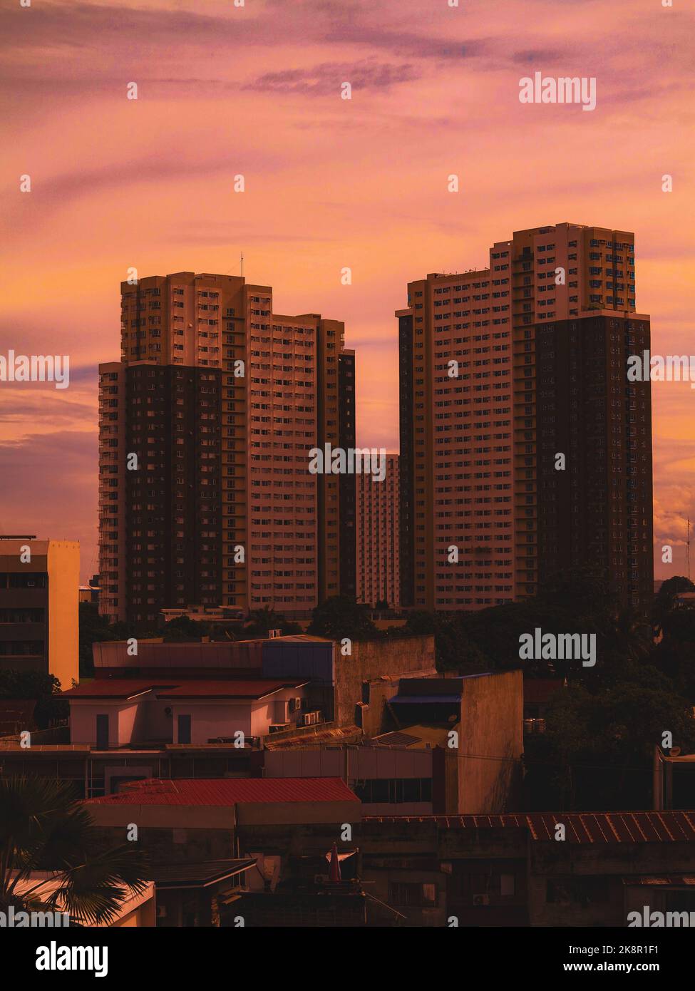 A vertical shot of tall buildings in Manila, Philippines during the ...