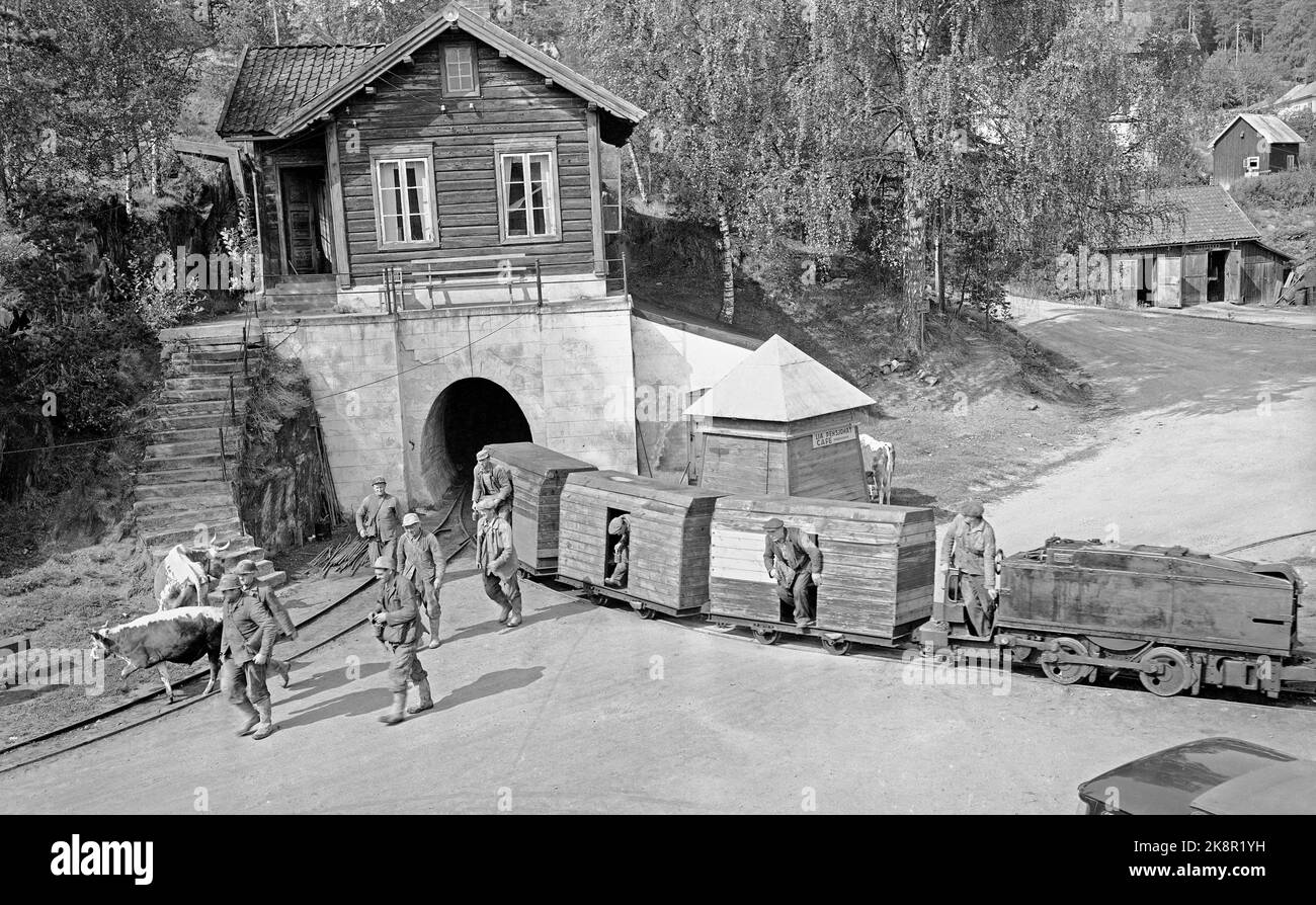 Wagons on rails carry miners out of mine photo hi-res stock photography ...