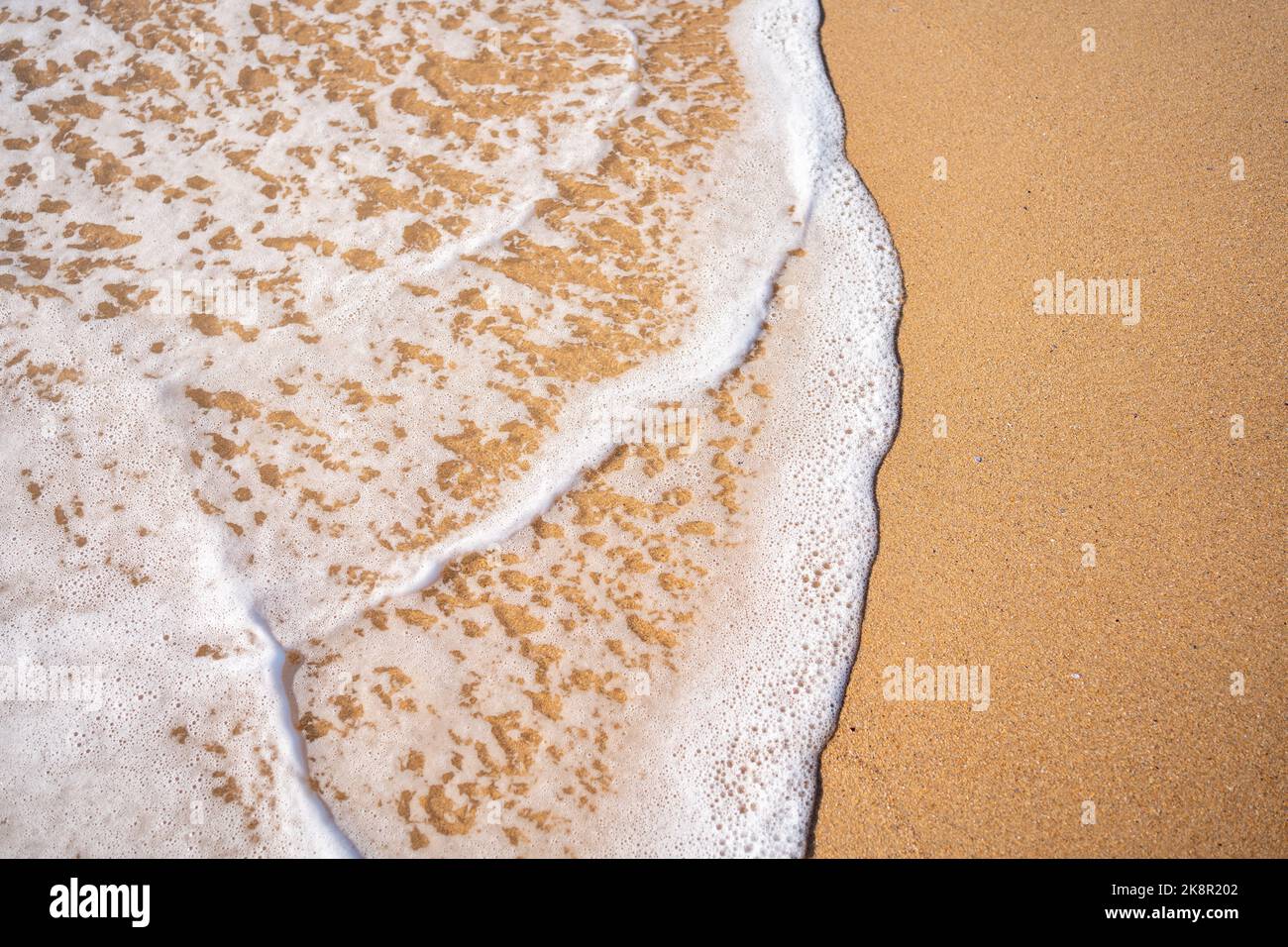 Soft beautiful ocean wave on sandy beach. Background. Turquoise color ...