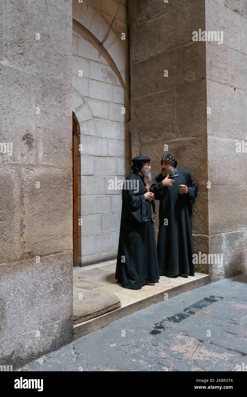 Two priests in discussion inside the Church of the Holy Sepulchre Stock ...
