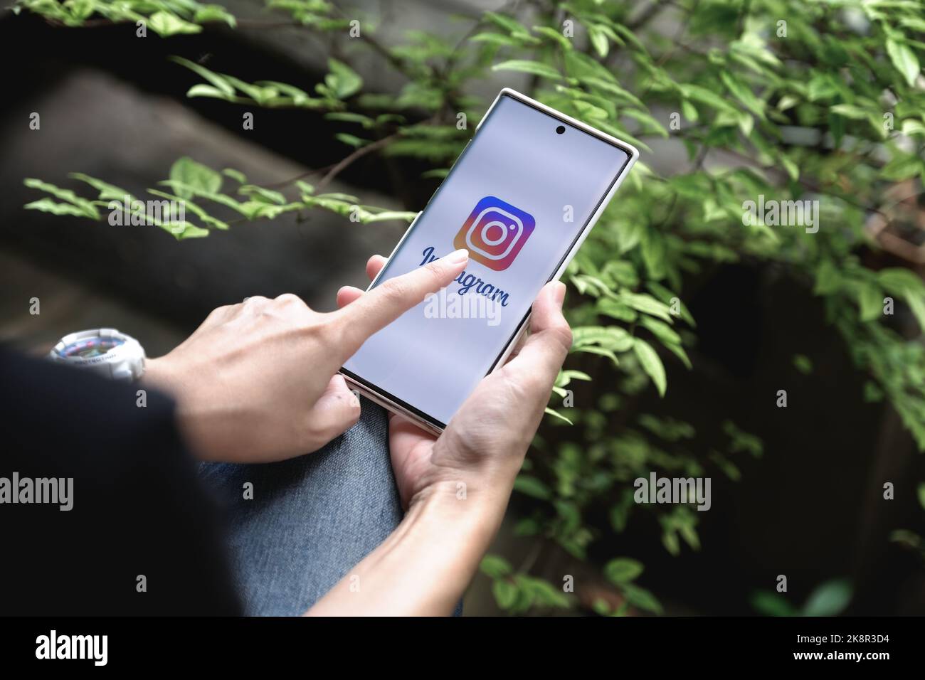 CHIANGMAI, THAILAND - July 09, 2021: A woman holding smartphone with ...