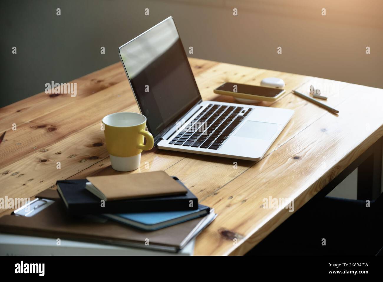 Working concept, computer, coffee mug, books and documents on the desk ...