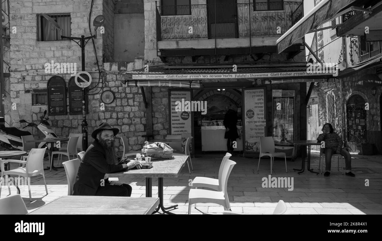 Religious Jewish man siting and smiling outside in Safed Stock Photo ...