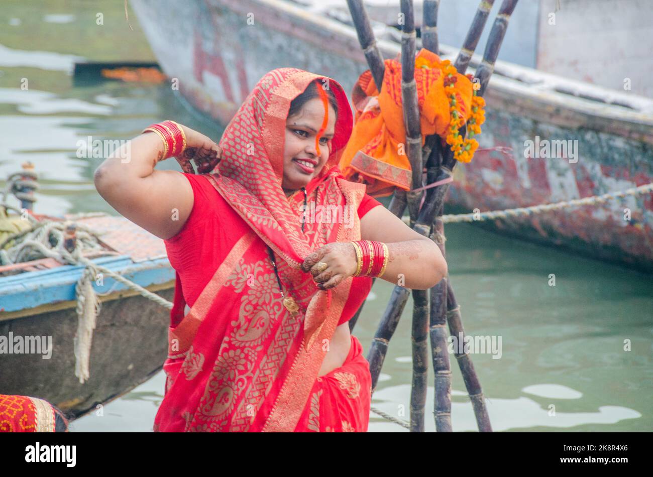 Unidentified Indian men and women pray and devote for Chhath Puja ...