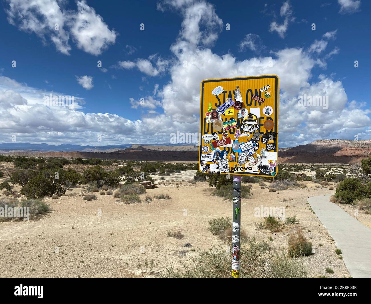 A closeup shot of stickers on a sign in the desert of Utah Stock Photo ...