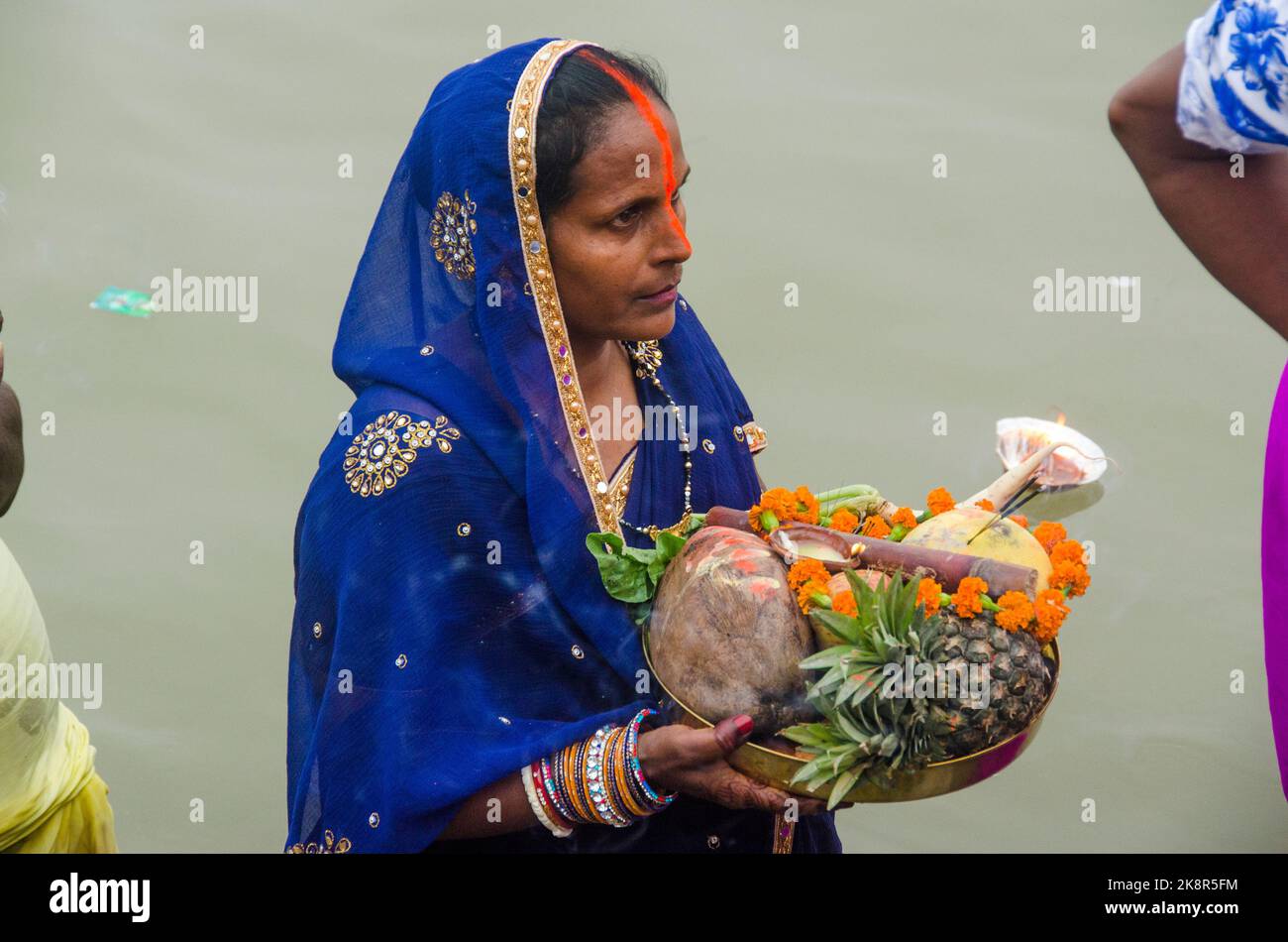 Unidentified Indian men and women pray and devote for Chhath Puja ...