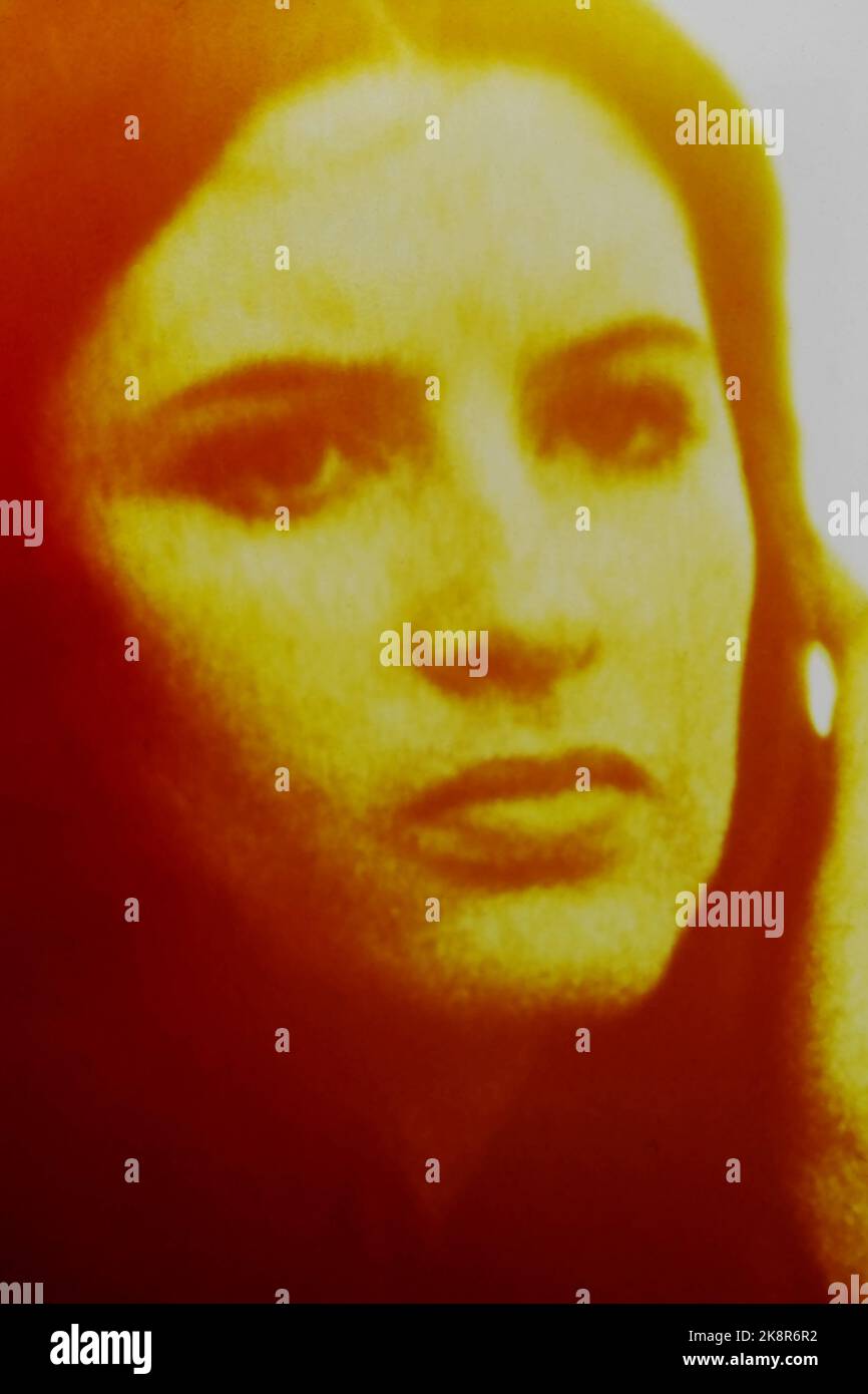 Grainy orange-filtered portrait of a young woman - abstract image Stock ...