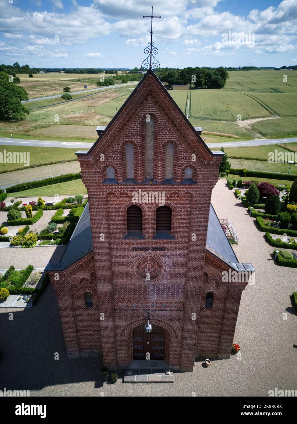 The vertical aerial view of Langskov Church on a sunny day in Torring ...
