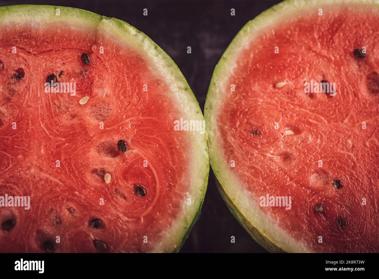 A top view of halved red delicious watermelons Stock Photo - Alamy