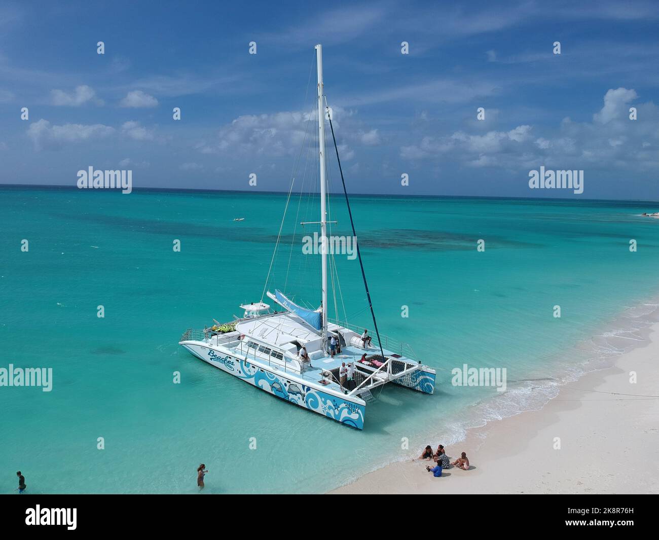 The aerial view of a yacht and people at the Turks and Caicos island's ...