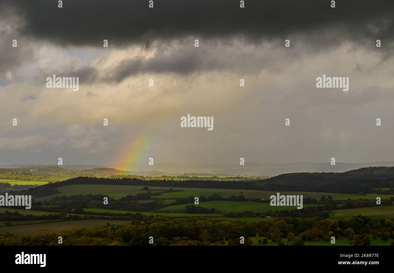 Win Green, Wiltshire, UK, 24th October 2022, Weather: A rainbow forms ...