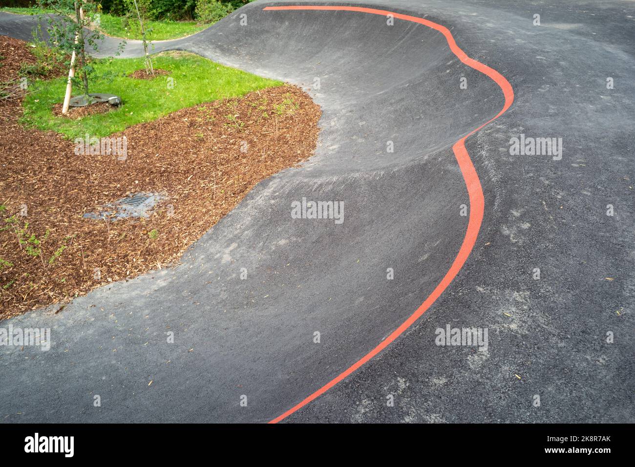 The view of a bike pump track marked with a red line in a park Stock ...