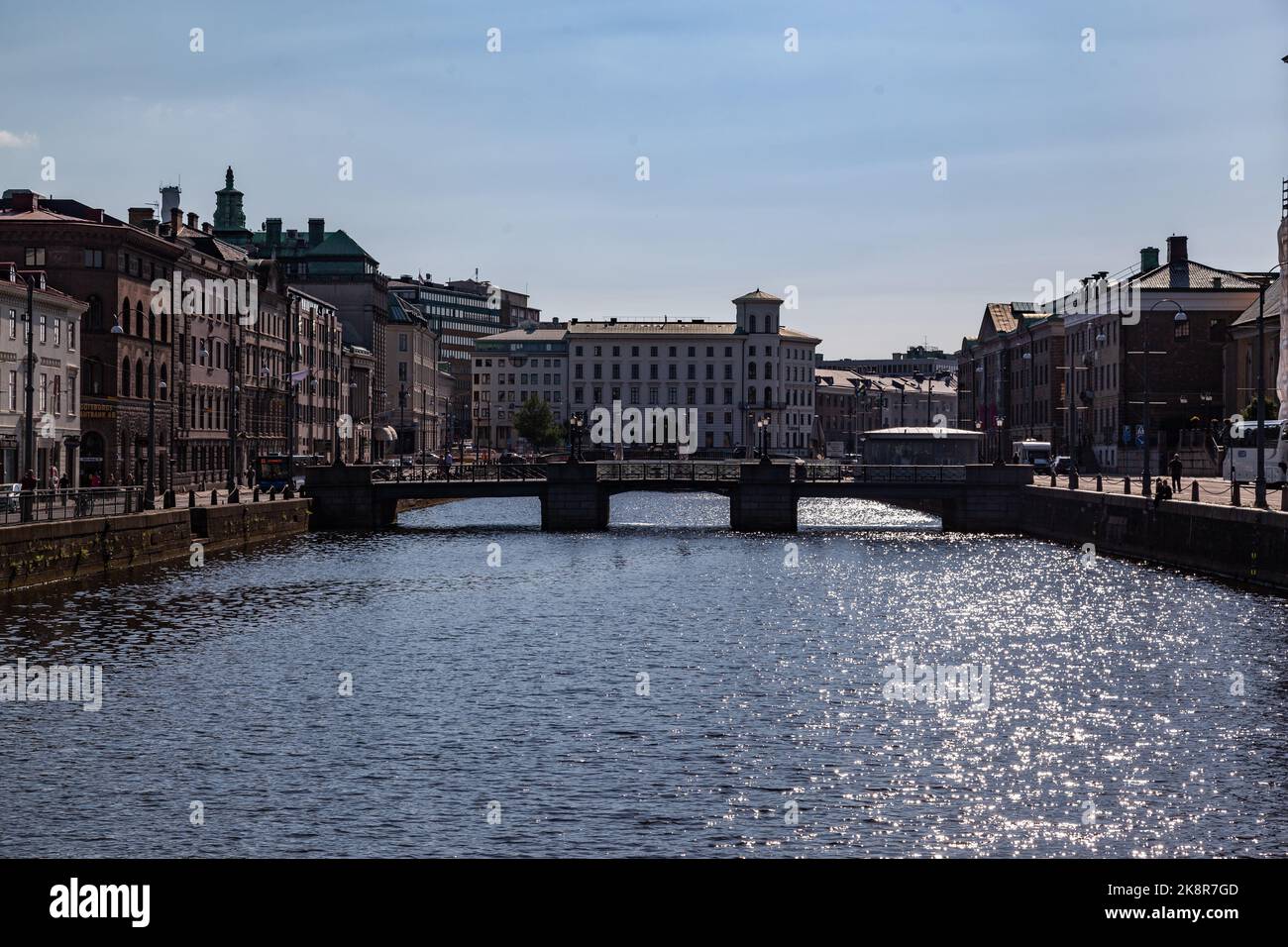 A scenic view of a bridge over a canal surrounded by historical ...