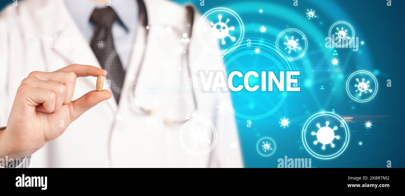 Doctor giving pill, virus concept Stock Photo - Alamy