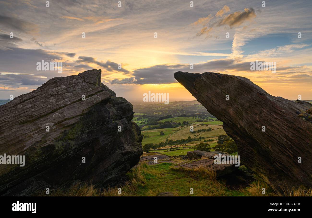Sun setting behind the rocks in the Peak District. The Roaches Stock ...