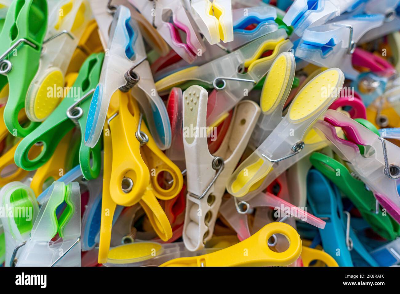 A closeup shot of yellow, green, red and blue laundry hangers Stock ...