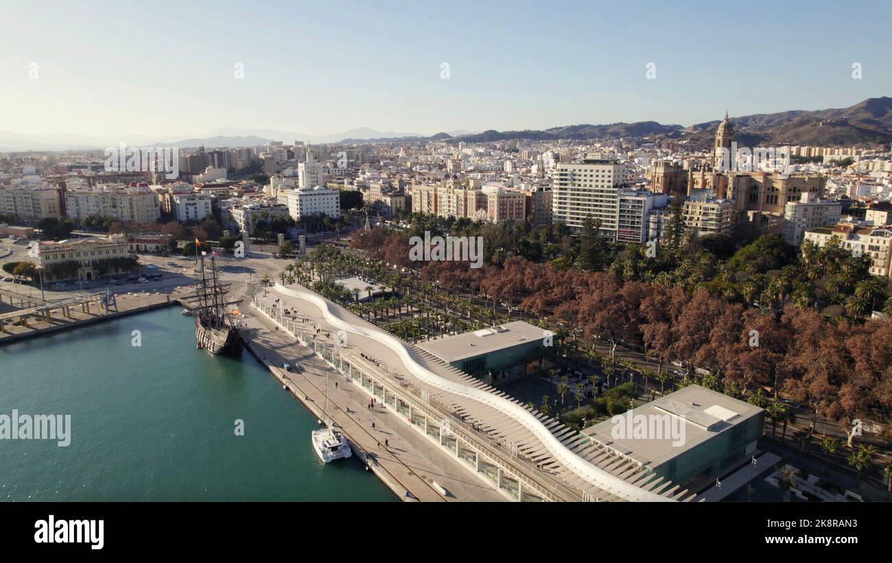 An aerial view of the Malaga Port in Spain with tall buildings and ...