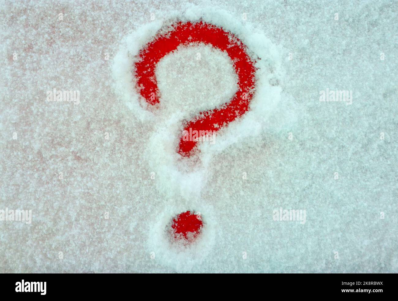 A question mark painted on a snow-covered red pedestal Stock Photo - Alamy