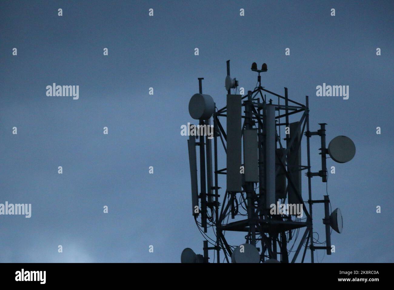 A modern metallic teleporter with a raincoat sky on the horizon Stock ...