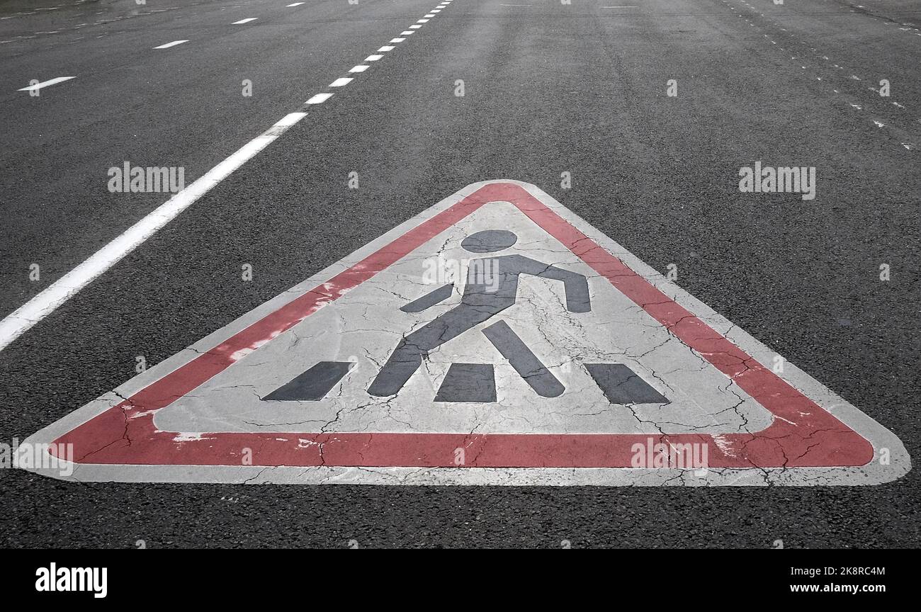 Traffic sign Caution Pedestrian crossing painted on asphalt road Stock ...