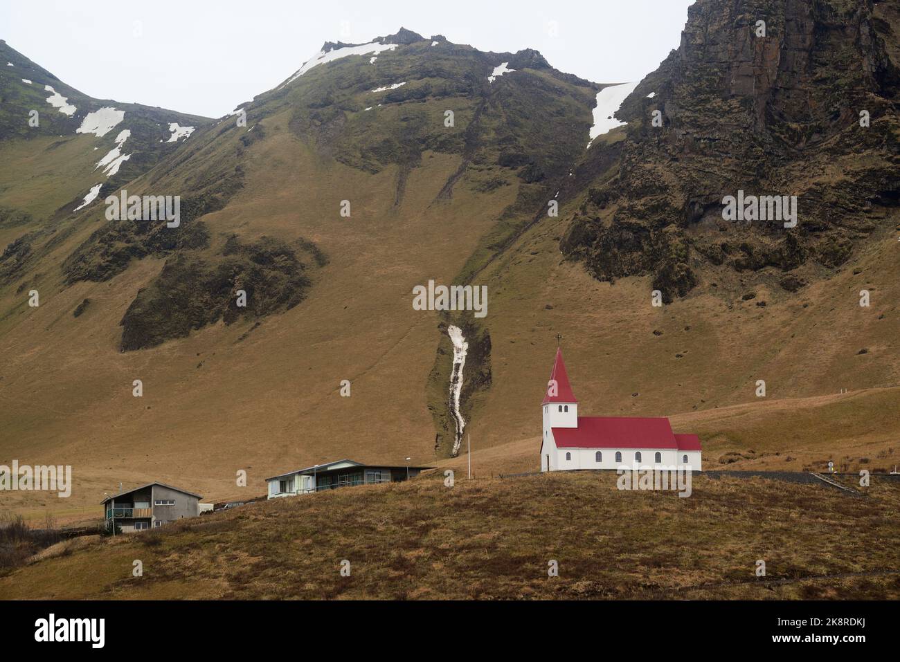 A beautiful view of the village of Vik, Iceland with houses and Vik ...