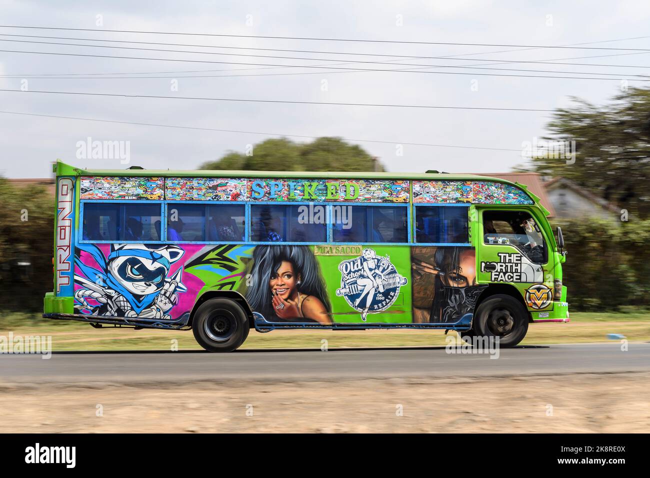 A bus with custom paintwork driving along Ngong road near the junction ...