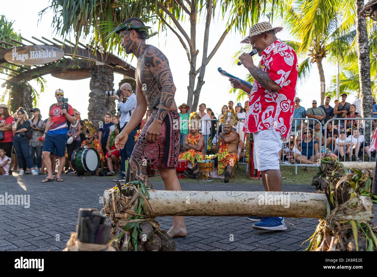 People wearing traditional clothes running with fruits during a ...