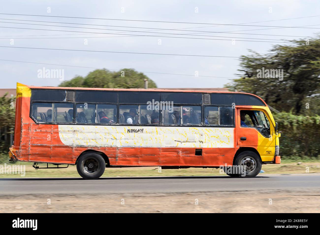 A bus with custom paintwork driving along Ngong road near the junction ...