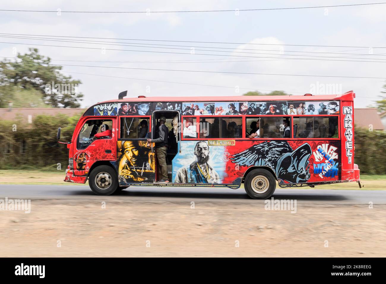 A bus with custom paintwork driving along Ngong road near the junction ...
