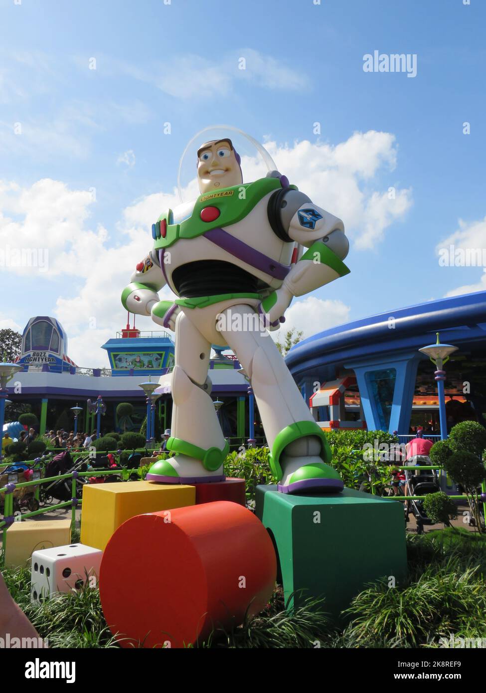 A statue of Buzz Lightyear from the movie "Toy Story" at dusk in ...