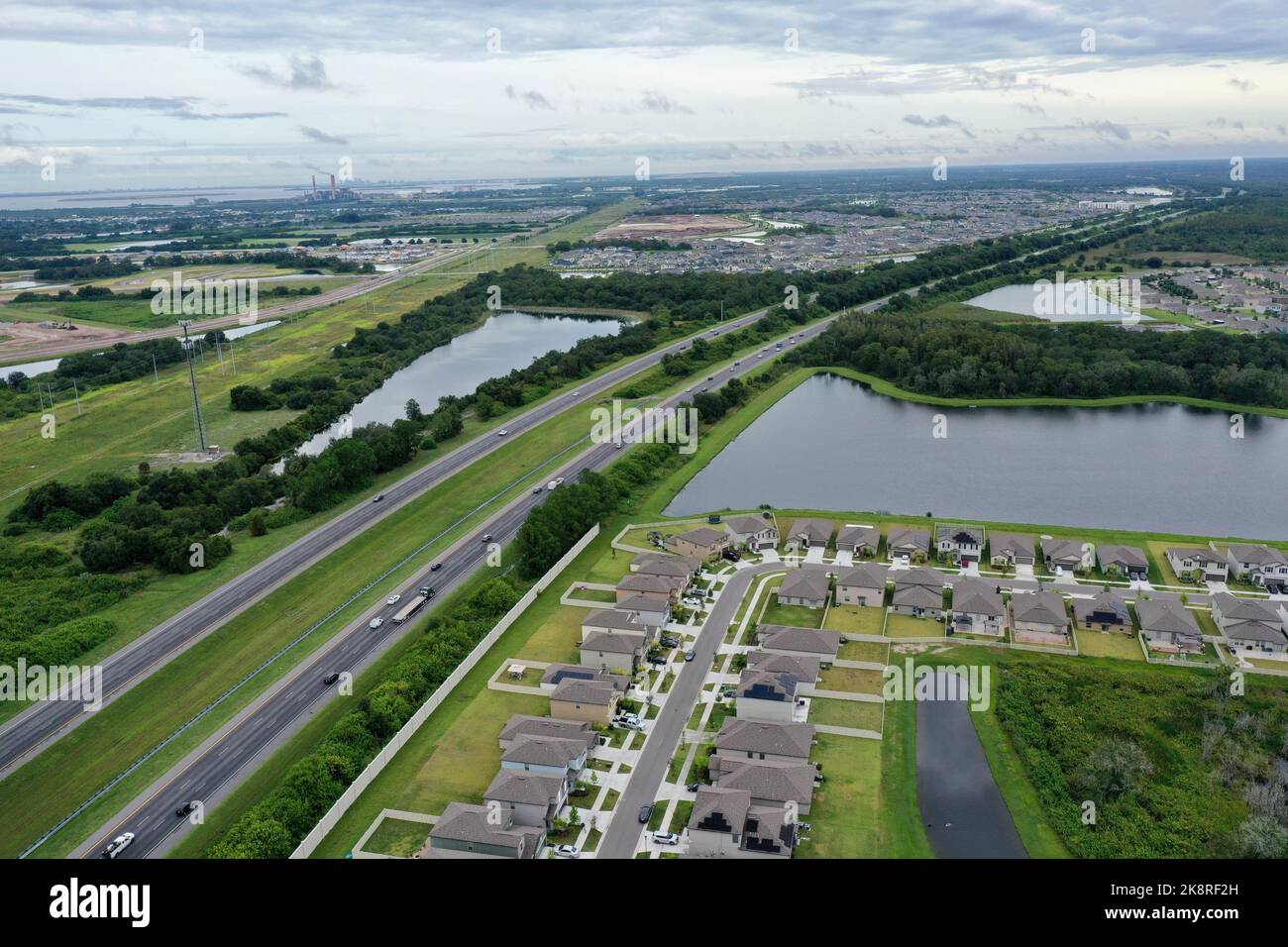 An aerial view of roads and a suburb in Austin, Texas with lagoons, the ...