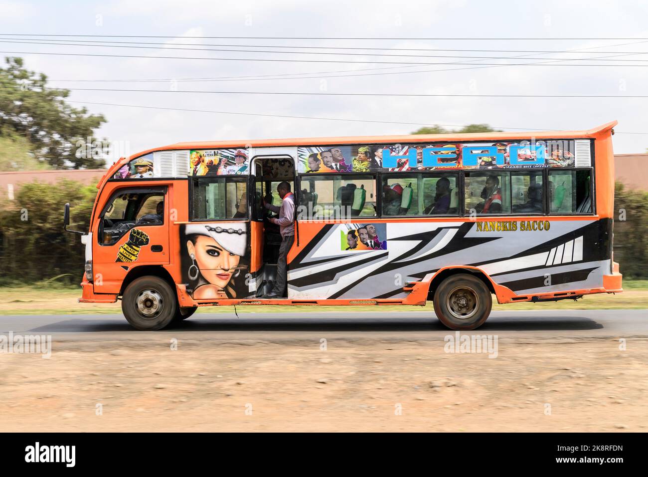 A bus with custom paintwork driving along Ngong road near the junction ...