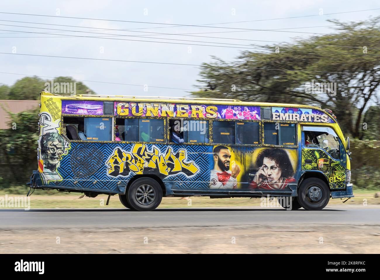 A bus with custom paintwork driving along Ngong road near the junction ...