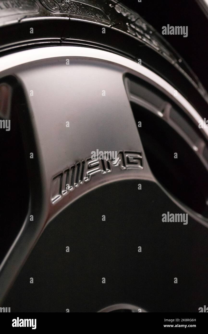 A vertical closeup shot of a Mercedes Benz AMG GT63s wheel with an AMG ...