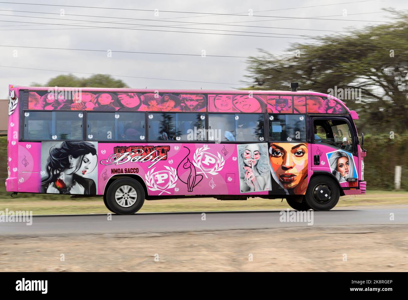 A bus with custom paintwork driving along Ngong road near the junction ...