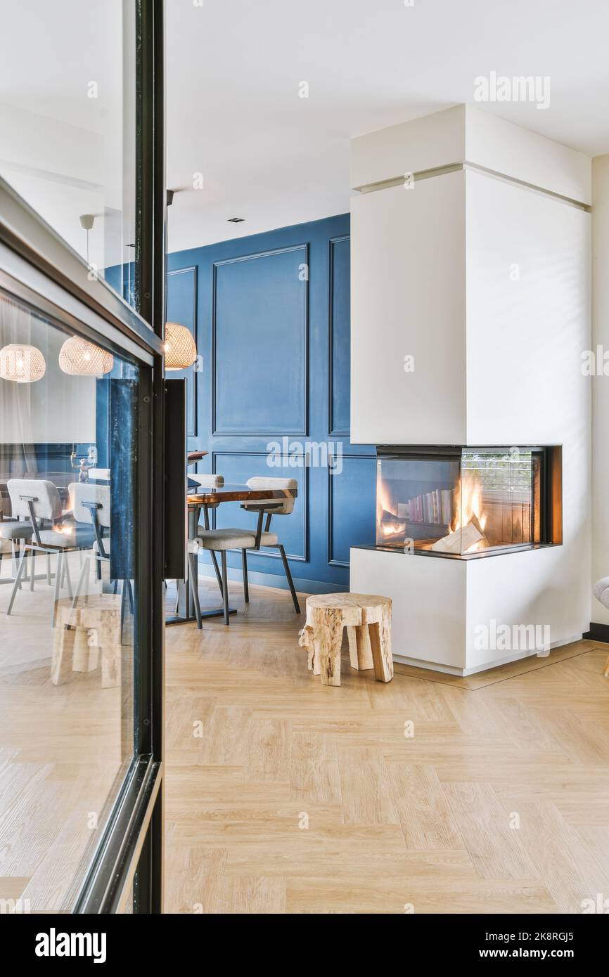 Couches and table located near TV against dining area of spacious room ...