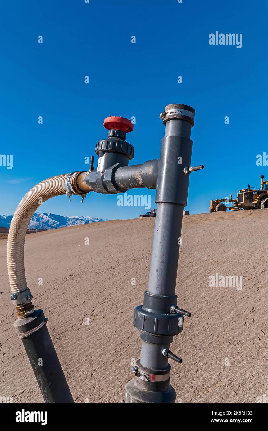 A vertical landfill methane gas wellhead and valve at an active ...