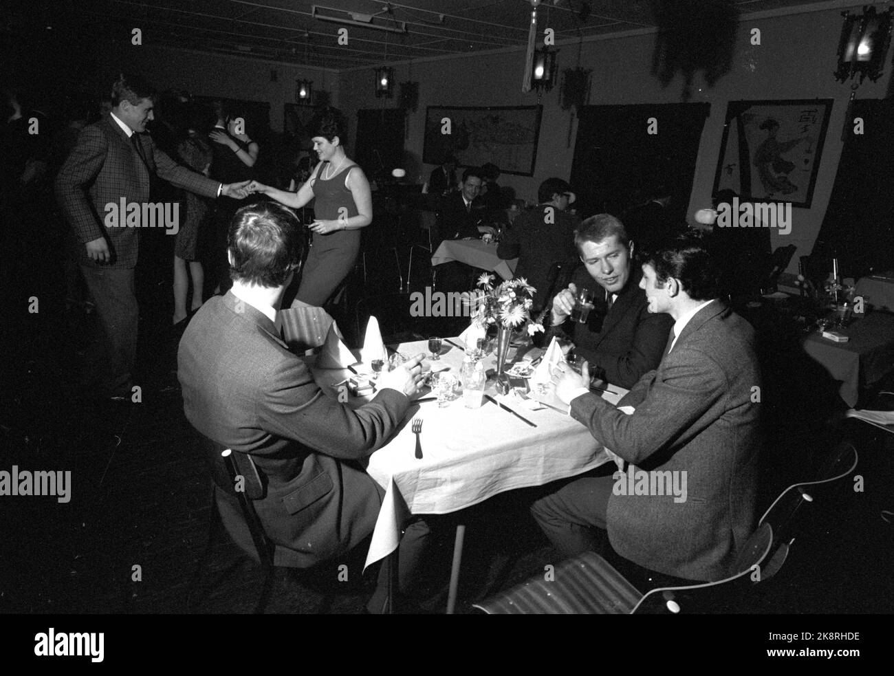 Longyearbyen residents enjoy food and dance in the house hi-res stock ...